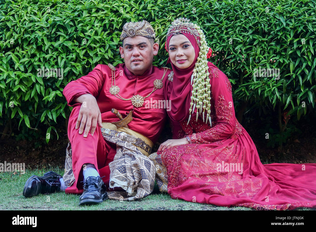 Traditional javanese wedding couple bride and bridegroom at garden ...