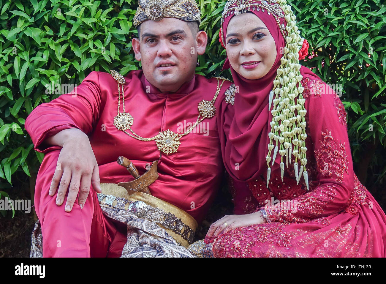 Traditional javanese wedding couple bride and bridegroom at garden ...