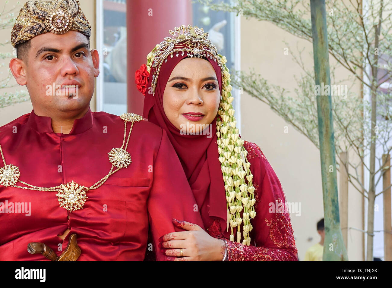 Traditional javanese wedding couple bride and bridegroom at garden ...