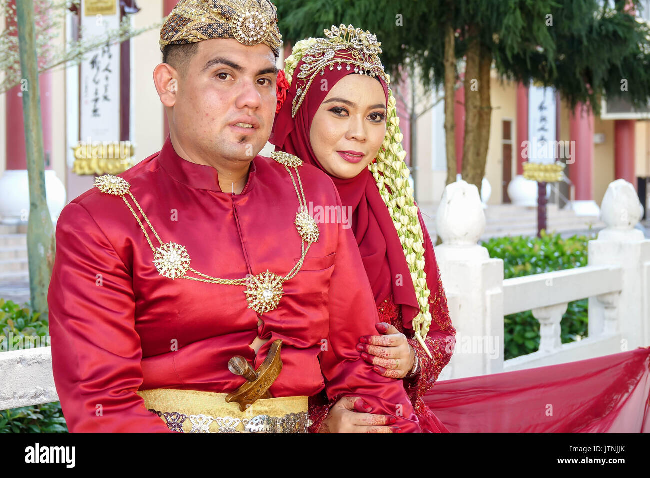 Traditional javanese wedding couple bride and bridegroom at garden ...