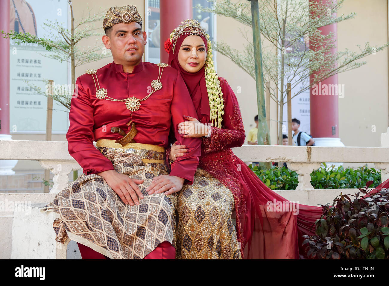 Traditional javanese wedding couple bride and bridegroom at garden ...