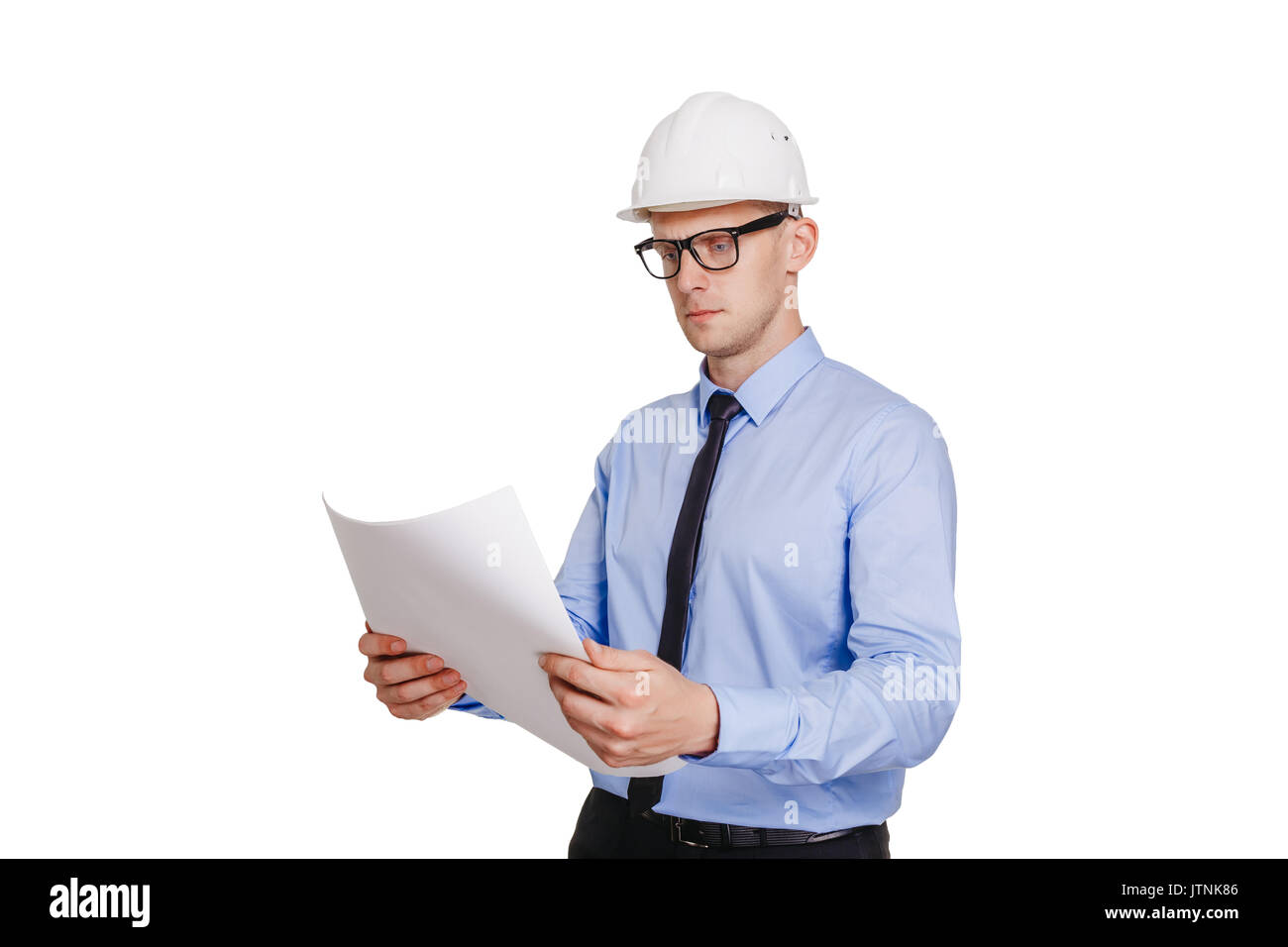 Construction engineer looking at the blueprint. Isolated on white Stock ...