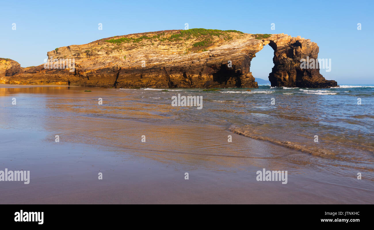 Natural arch at sand beach. As Catedrais beach - Cantabric coast. Spain ...