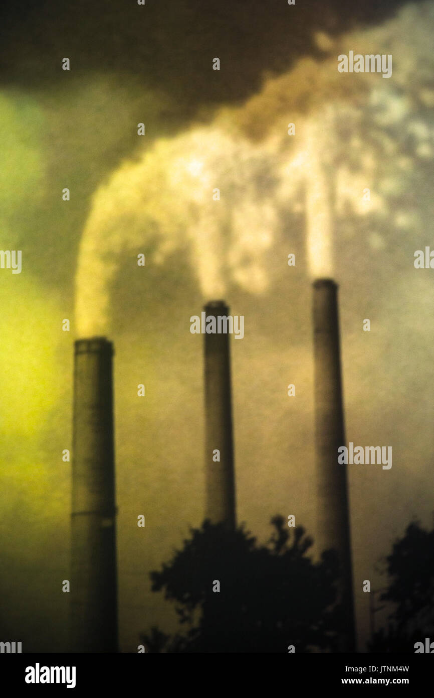 Industrial smoke stacks emitting smoke Stock Photo - Alamy