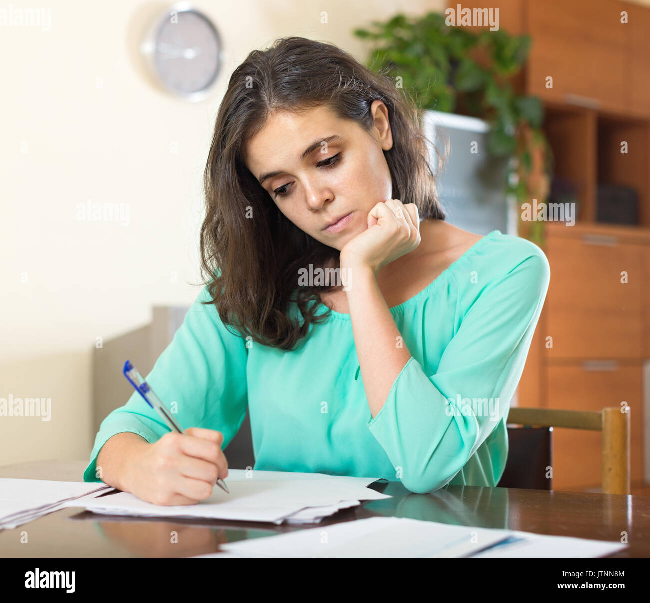 Girl and reading documents and pensive hi-res stock photography and ...