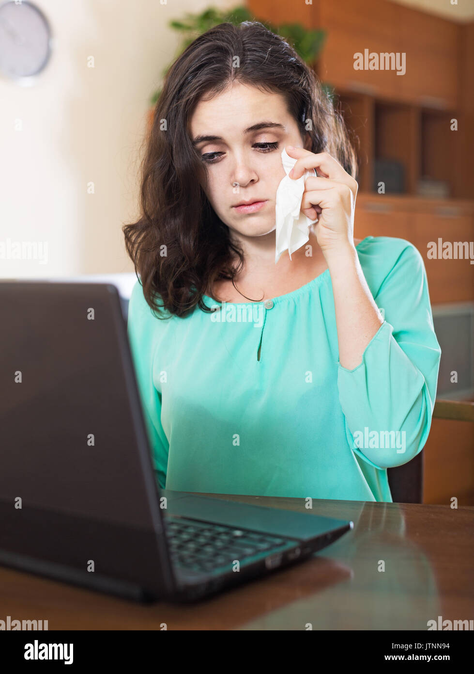 Woman reading documents and crying Stock Photo - Alamy