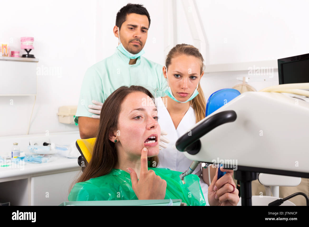 Female young patient detecting problems on inspection at the dentist ...