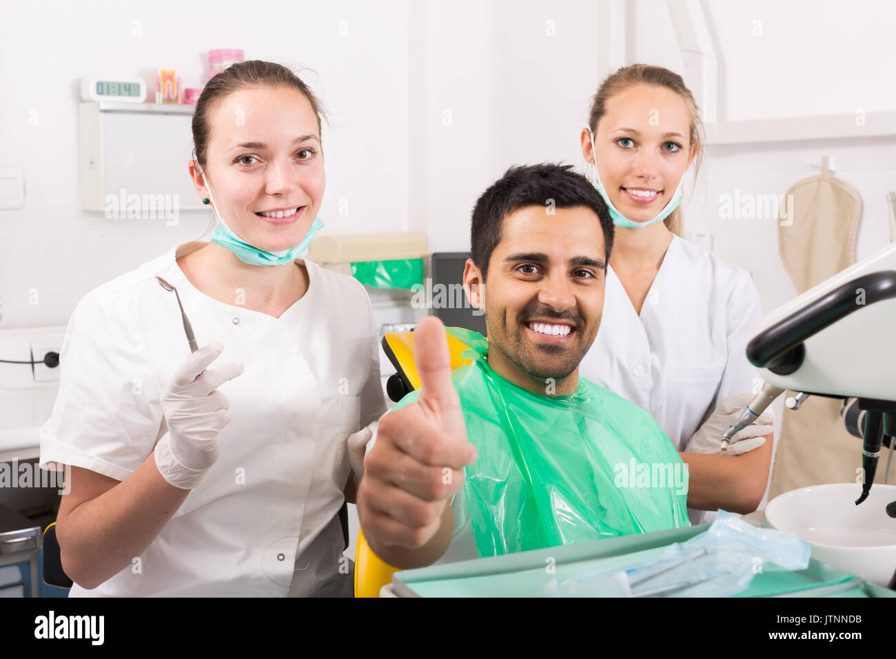 Happy cured patient in the dental clinic Stock Photo - Alamy