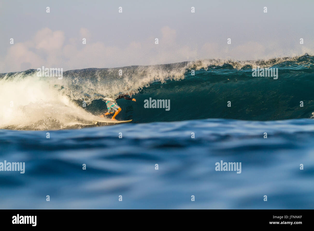 Photograph of surfer riding wave, Lakey Peak, central Sumbawa ...