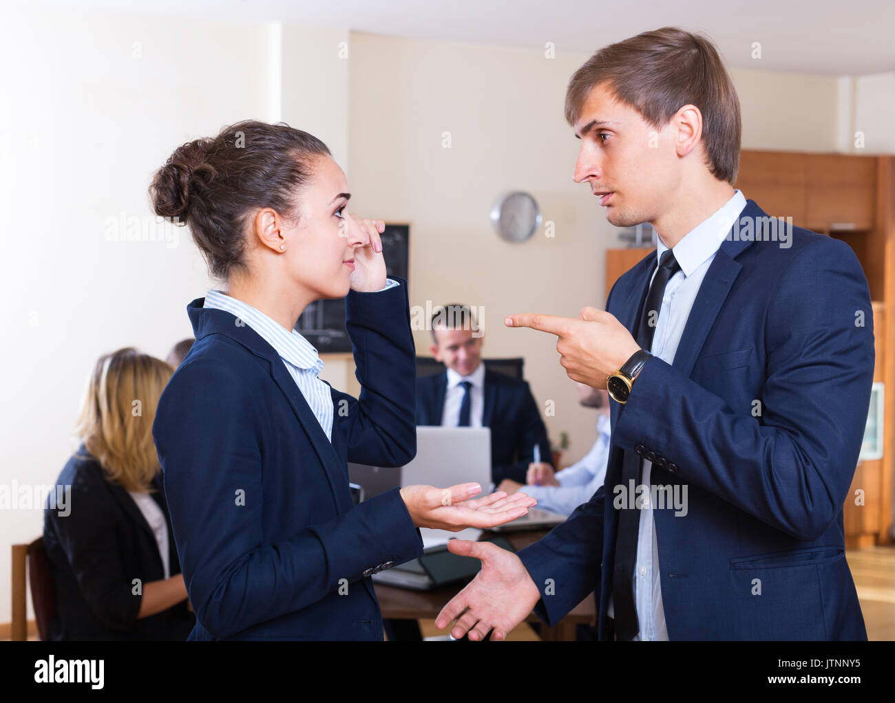 Manager lecturing mistaken team member severely at office meeting Stock ...