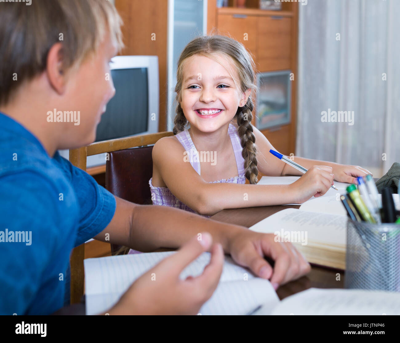 Boy doing notes in notebook hi-res stock photography and images - Alamy