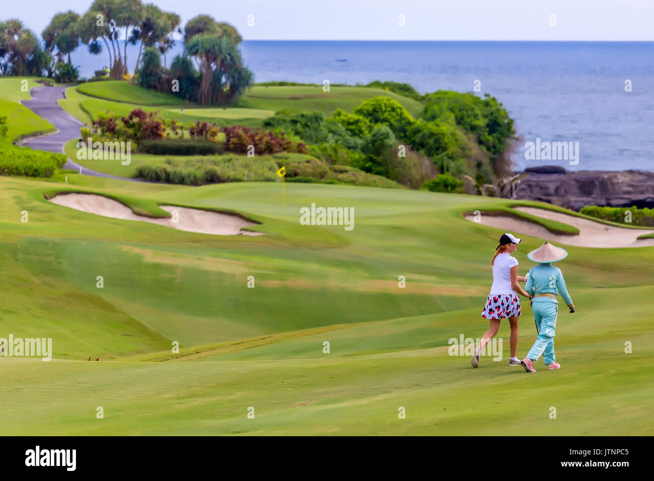 Golf player and caddy,Bali,Indonesia Stock Photo - Alamy