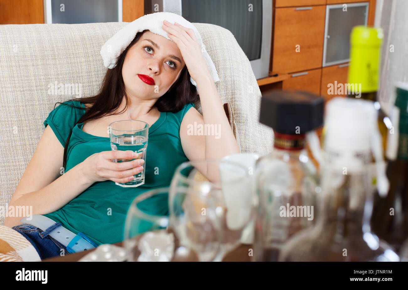 girl having headache after celebrating of holiday Stock Photo - Alamy