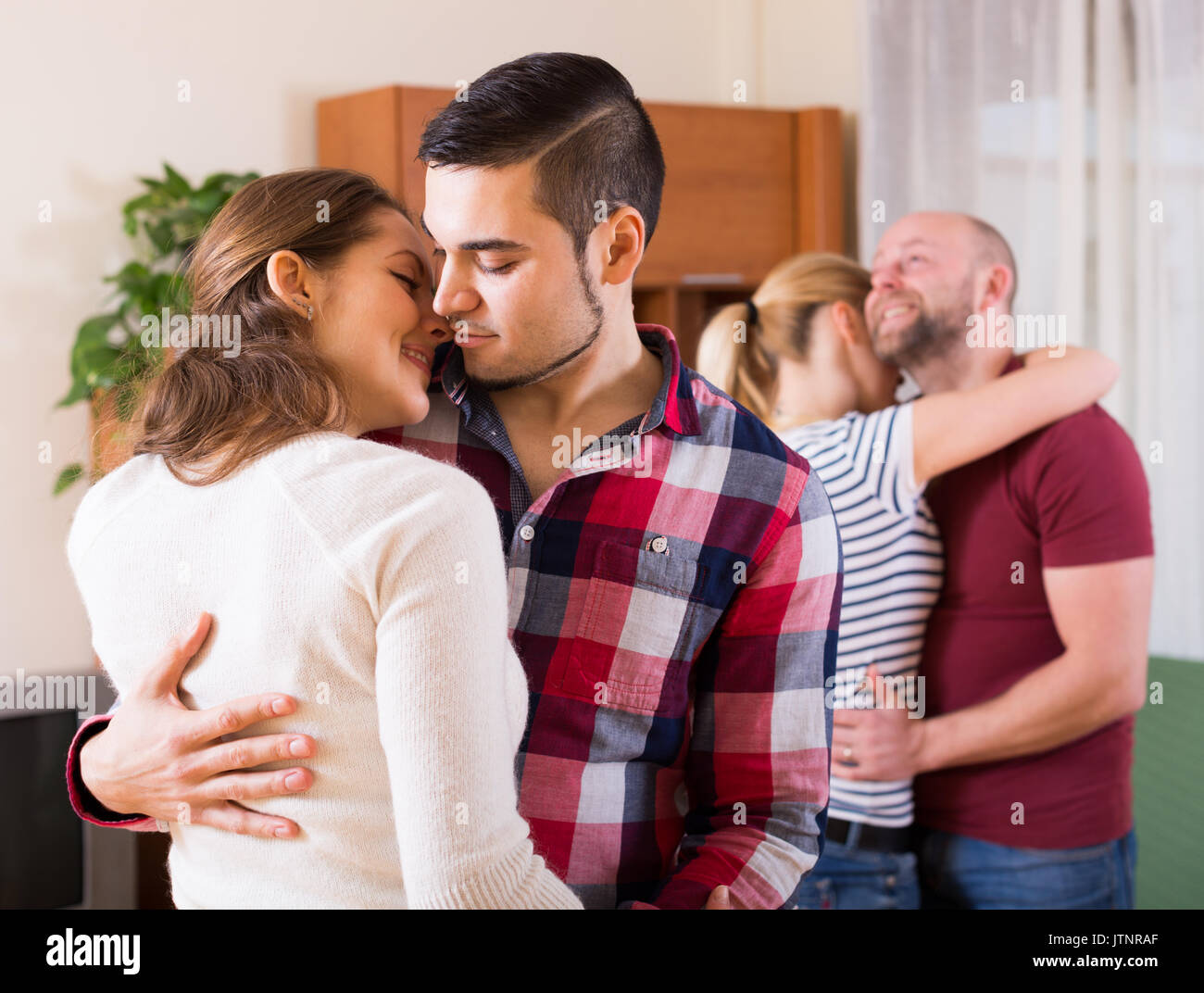Two couples dancing in slow dance Stock Photo - Alamy