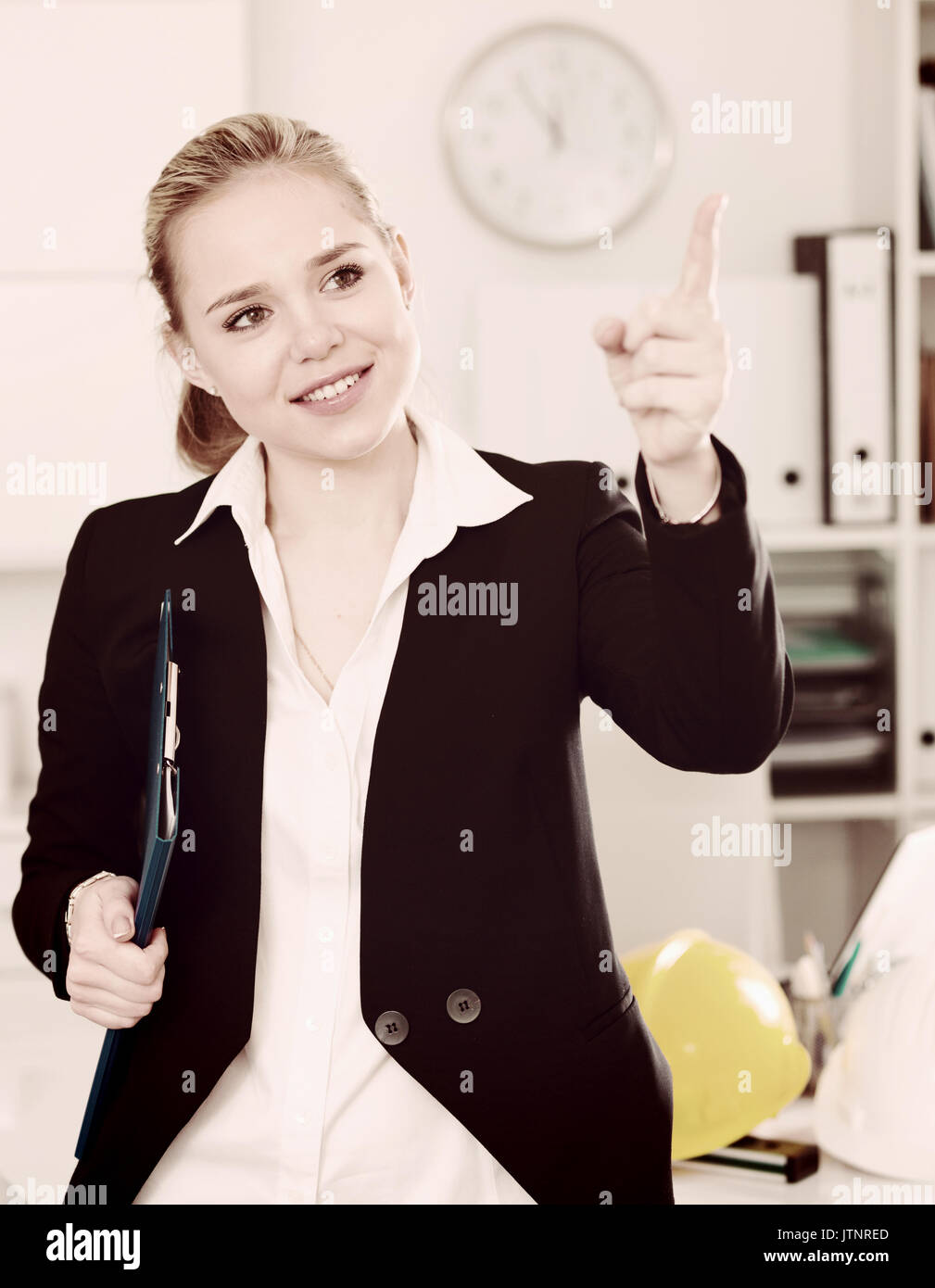 Attractive businesswoman pointing at something in design office Stock ...