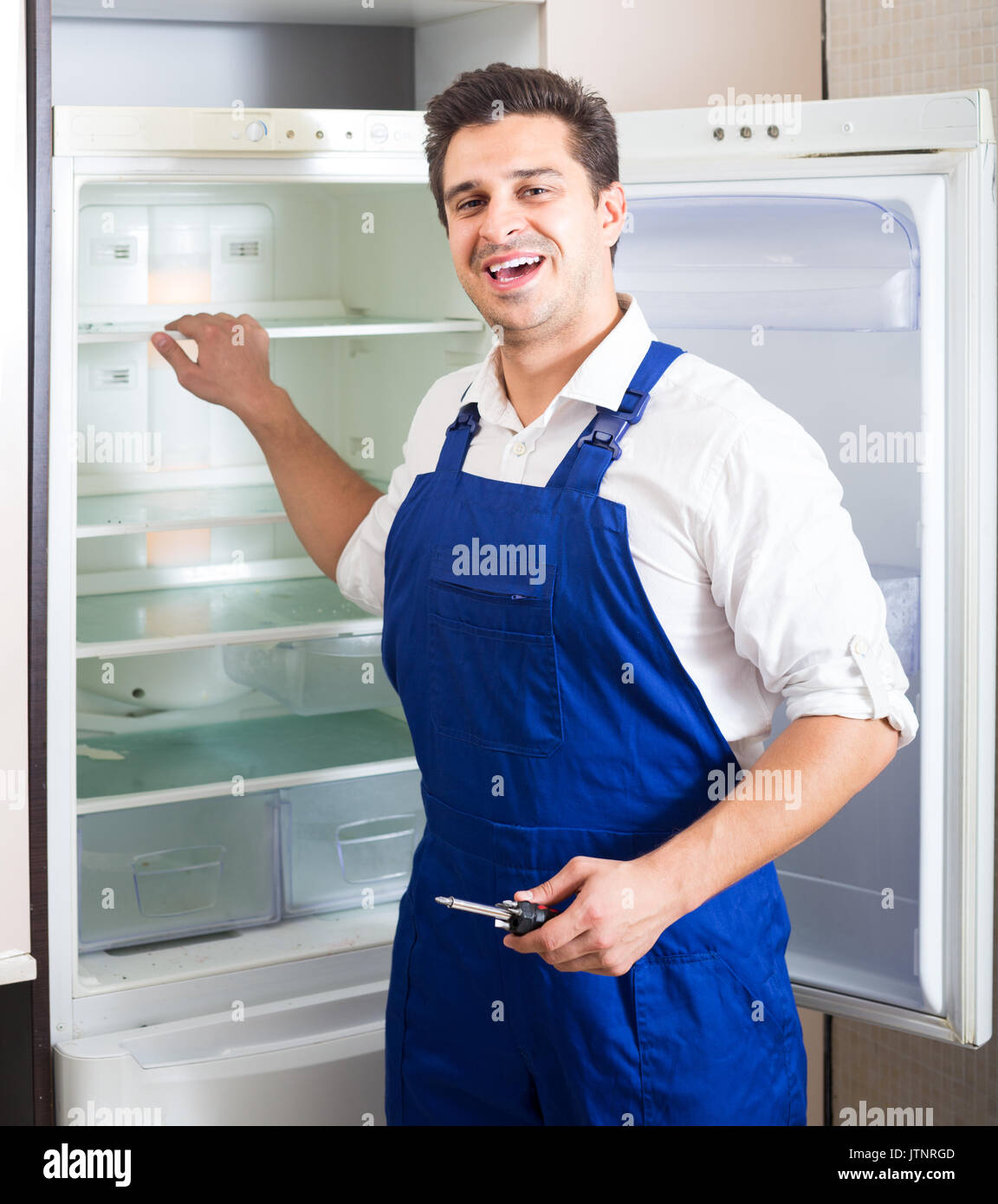 Man defrosting the fridge hi-res stock photography and images - Alamy