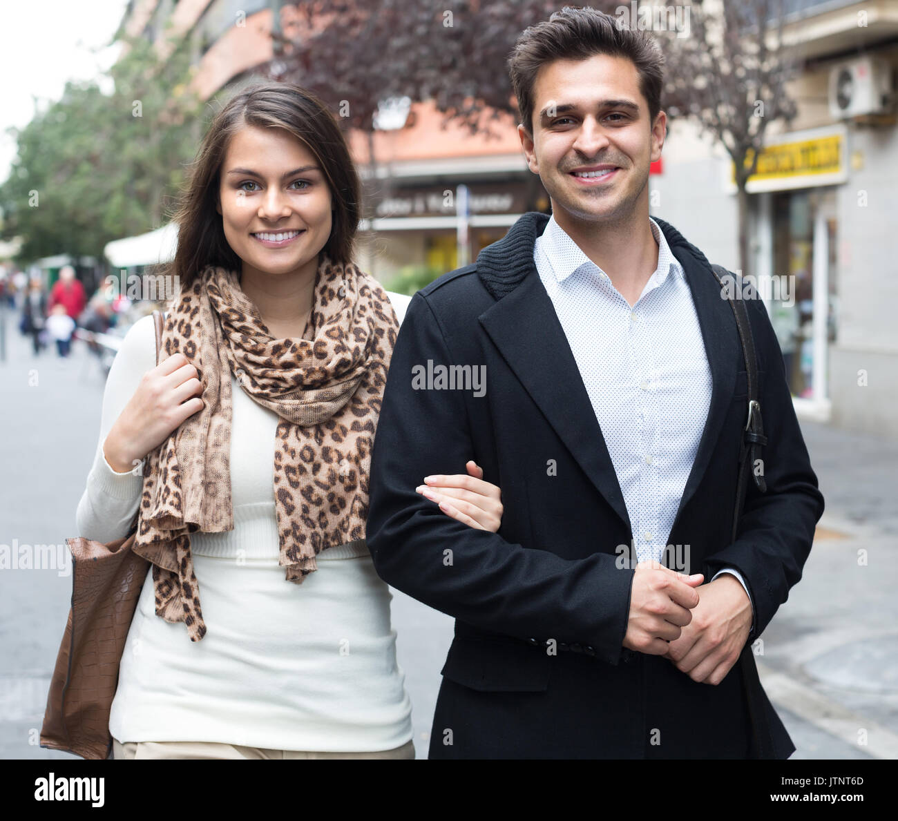Handsome man having date with attractive smiling girlfriend outdoors ...