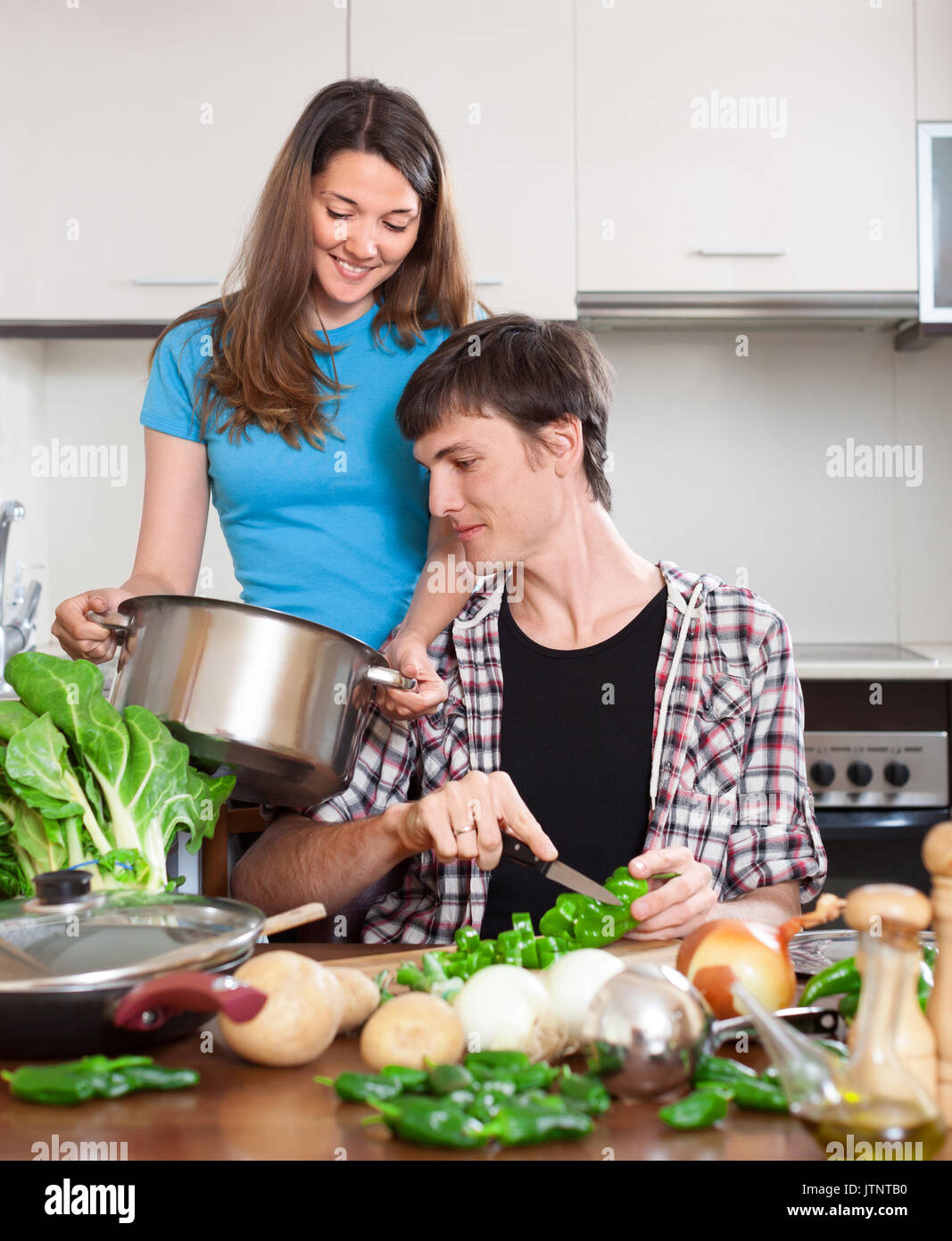 girl and the guy cook food at home Stock Photo - Alamy
