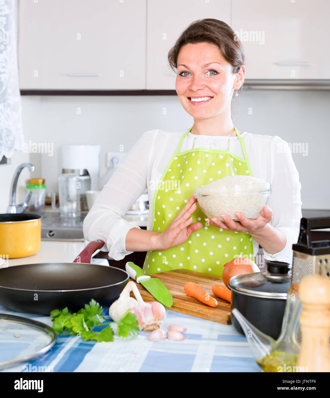 Woman cooking rice vegetables hi-res stock photography and images - Alamy