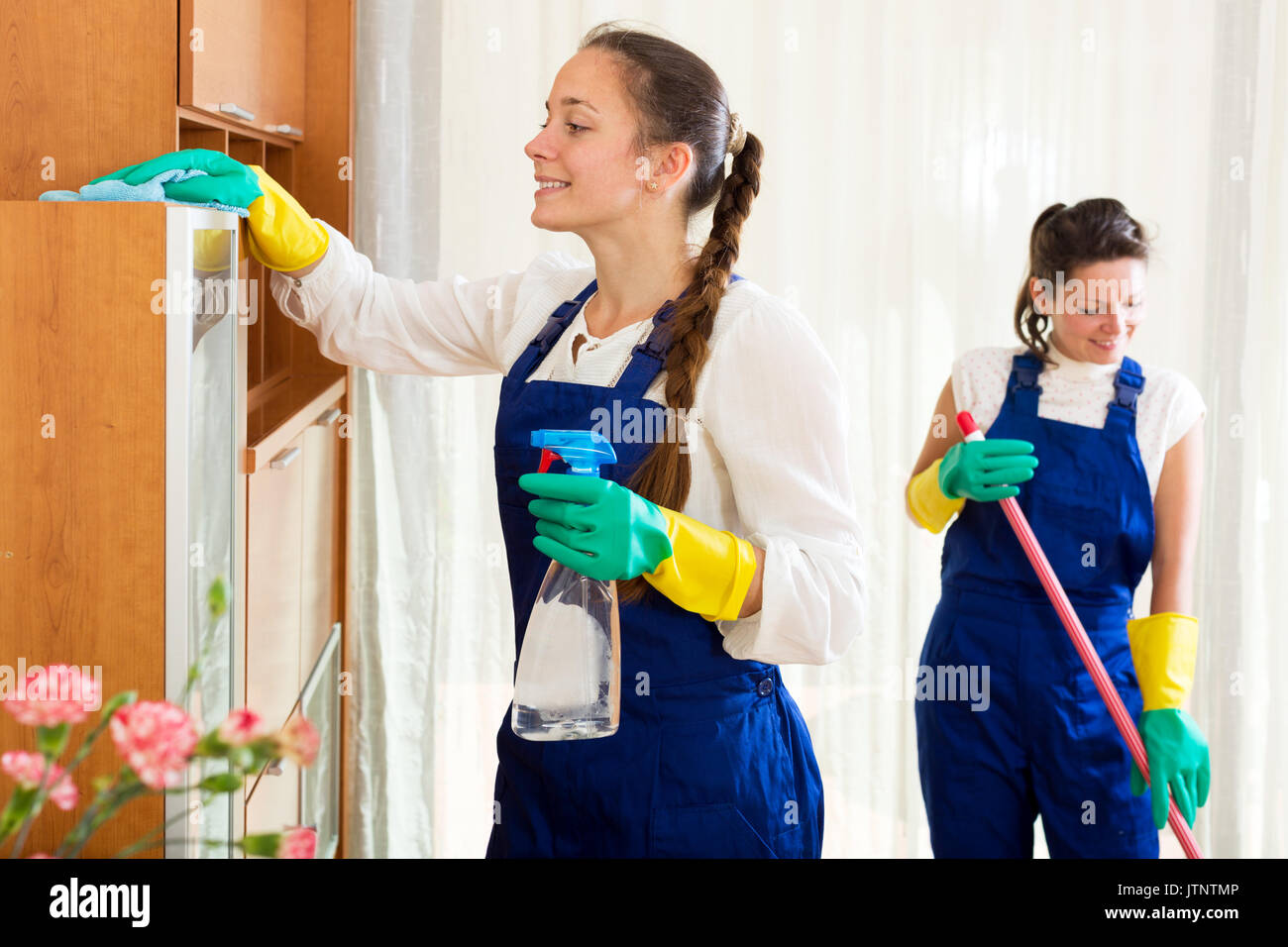 Happy female workers cleaning company ready to start work Stock Photo ...