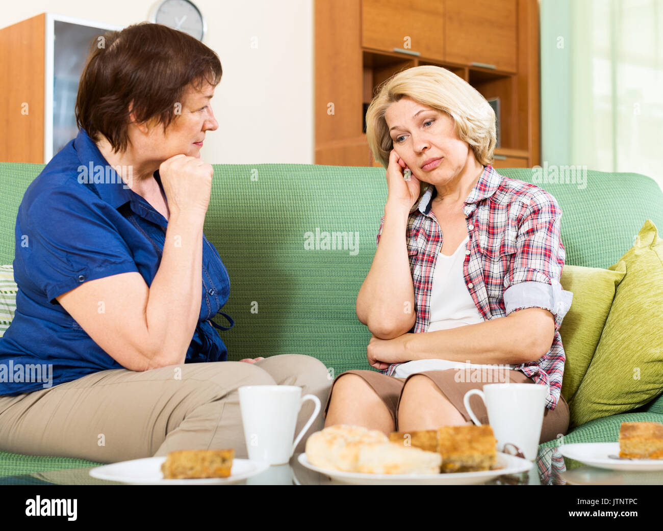 Two people talking sad and happy hi-res stock photography and images ...