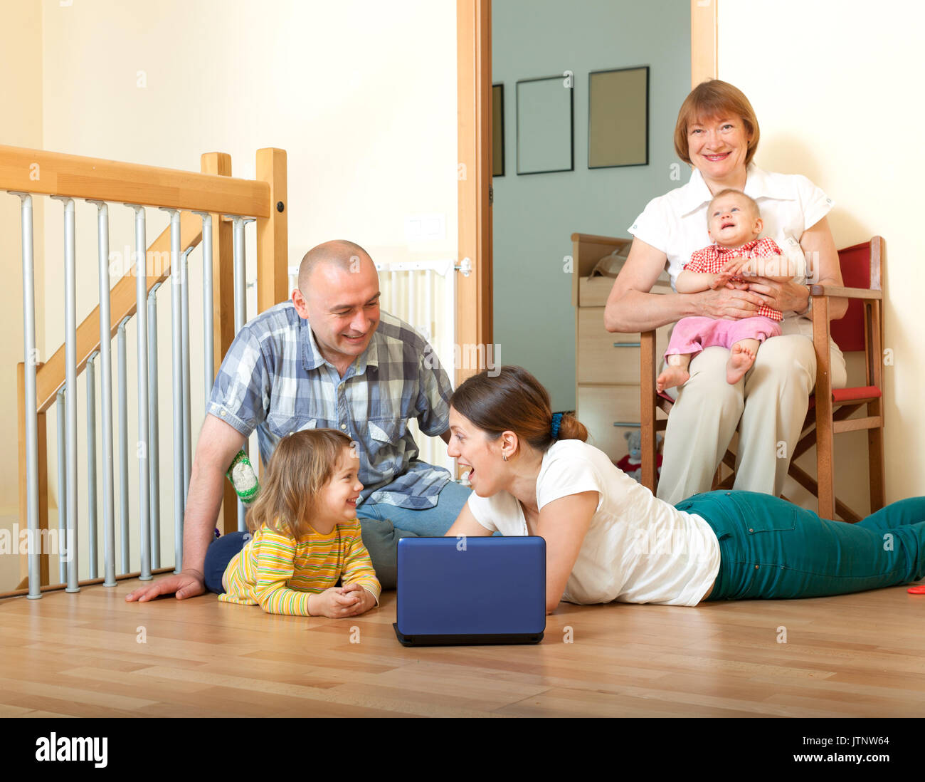 Girl with computer on floor hi-res stock photography and images - Alamy