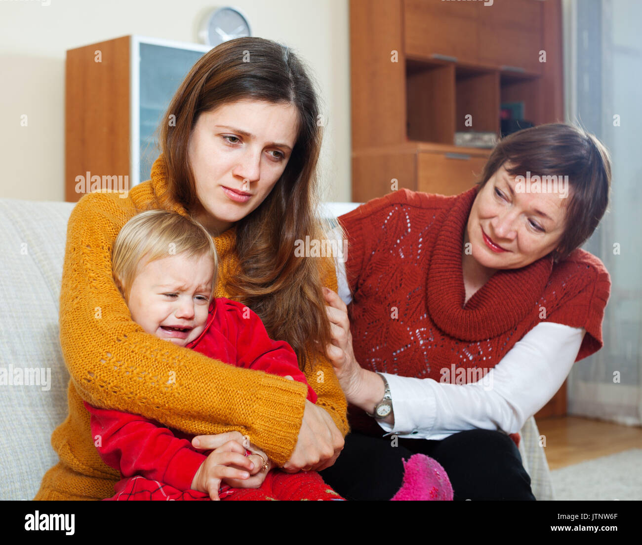 Young mother has trouble. Mature woman comforting adult daughter with ...