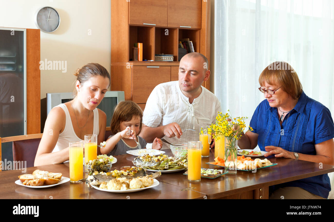 Senior woman eating fish hi-res stock photography and images - Alamy