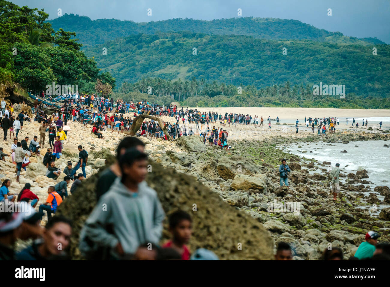 People gathering at beach before Pasola festival, Sumba Island ...