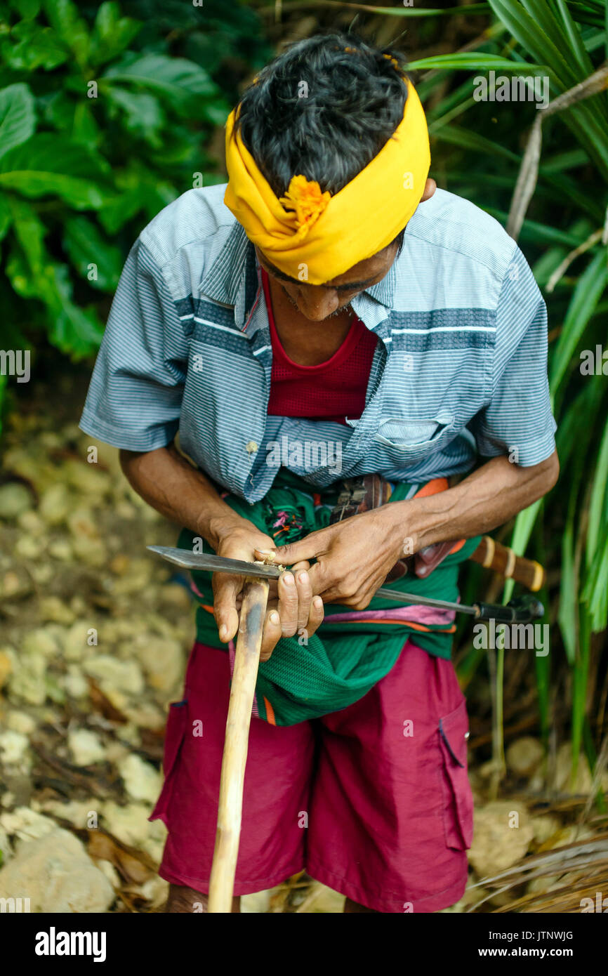 Man repairing tool, Sumba Island, Indonesia Stock Photo - Alamy