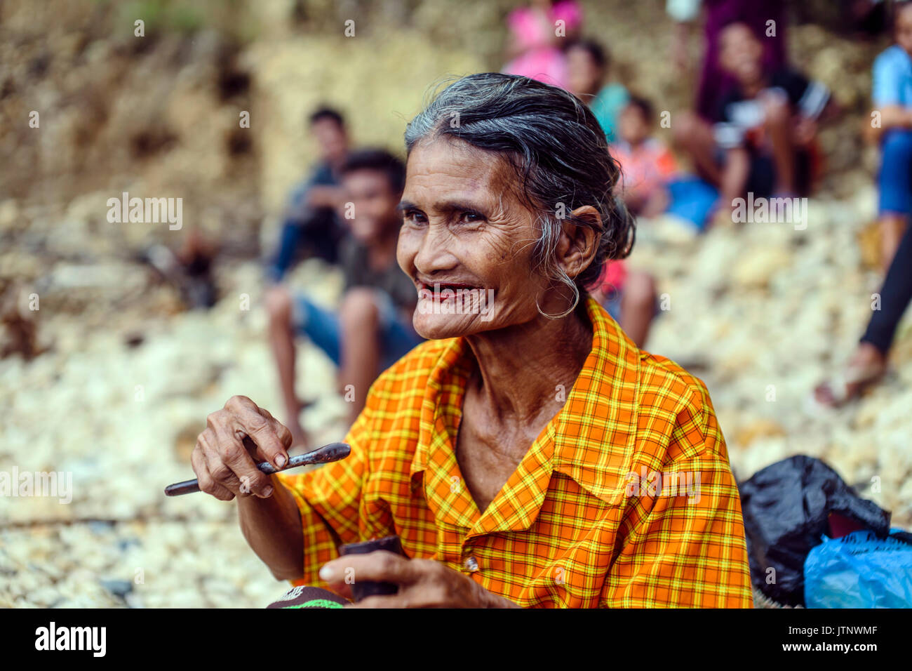Portrait of senior woman eating betel nut, Sumba Island, Indonesia ...