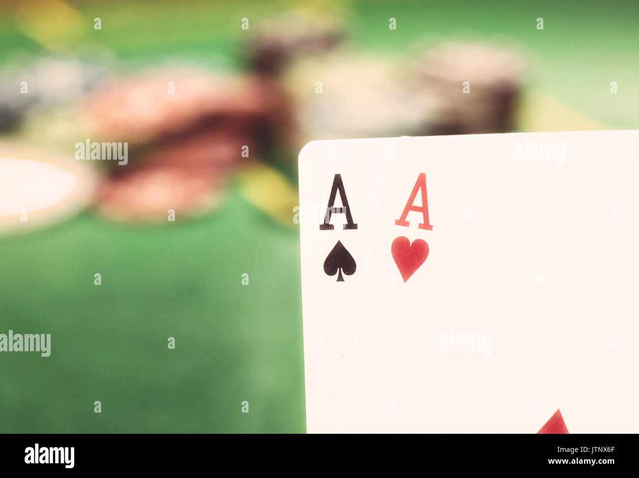 Two aces with blurred background. Light toned Stock Photo - Alamy