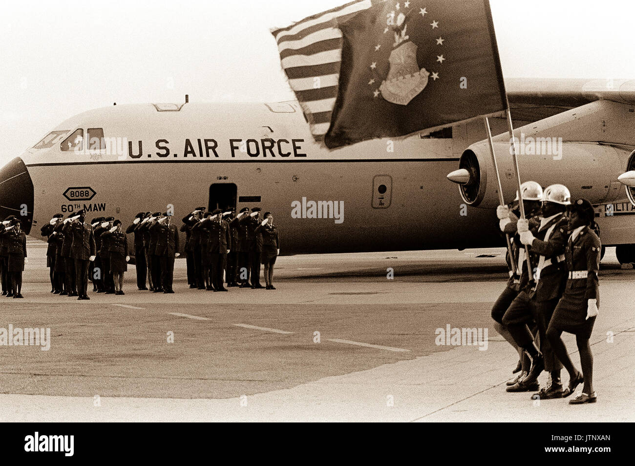 An Air Force Honor Guard Salutes The Flags As They Are Paraded
