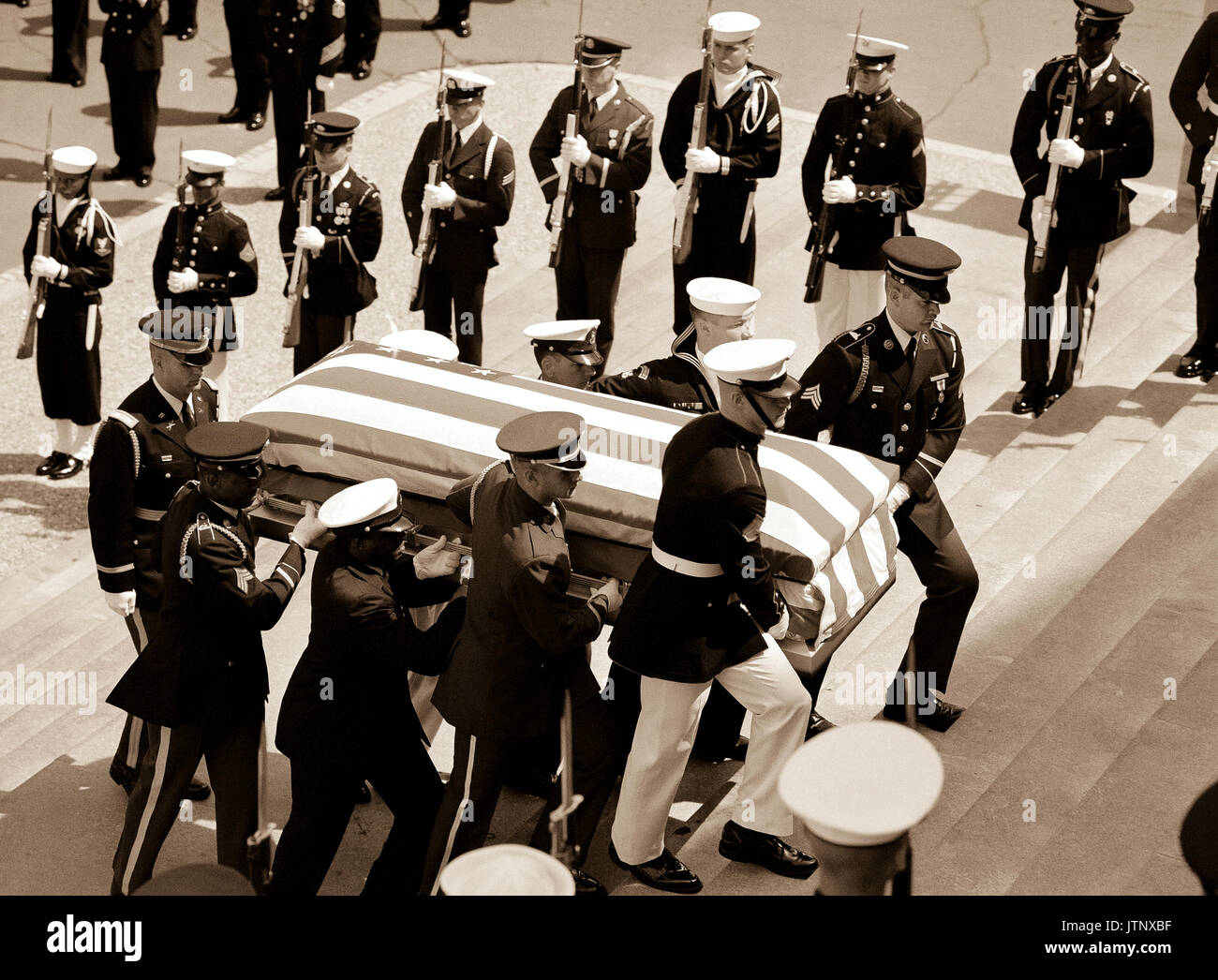 A joint services casket team carries the Unknown Serviceman of the ...