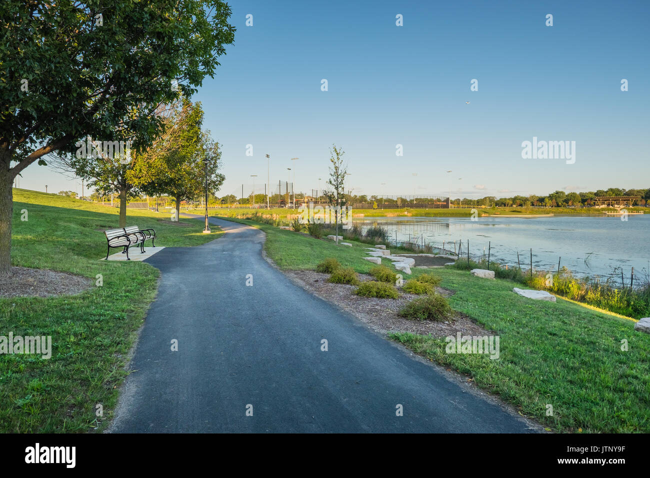 pathway with bench at park Stock Photo - Alamy