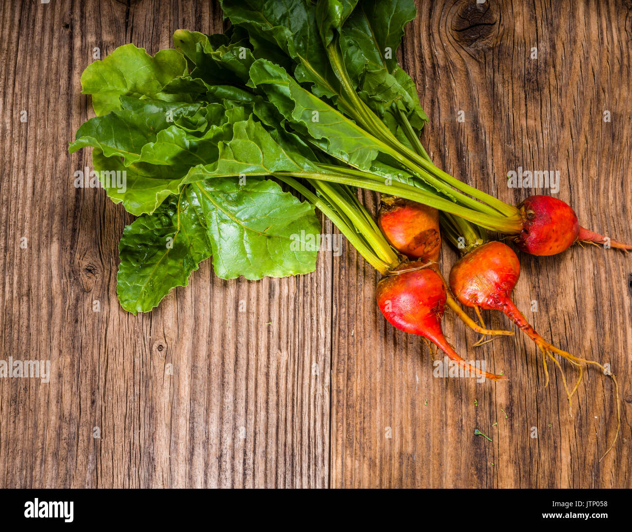 Orange beets on wooden table fresh from the garden Stock Photo - Alamy