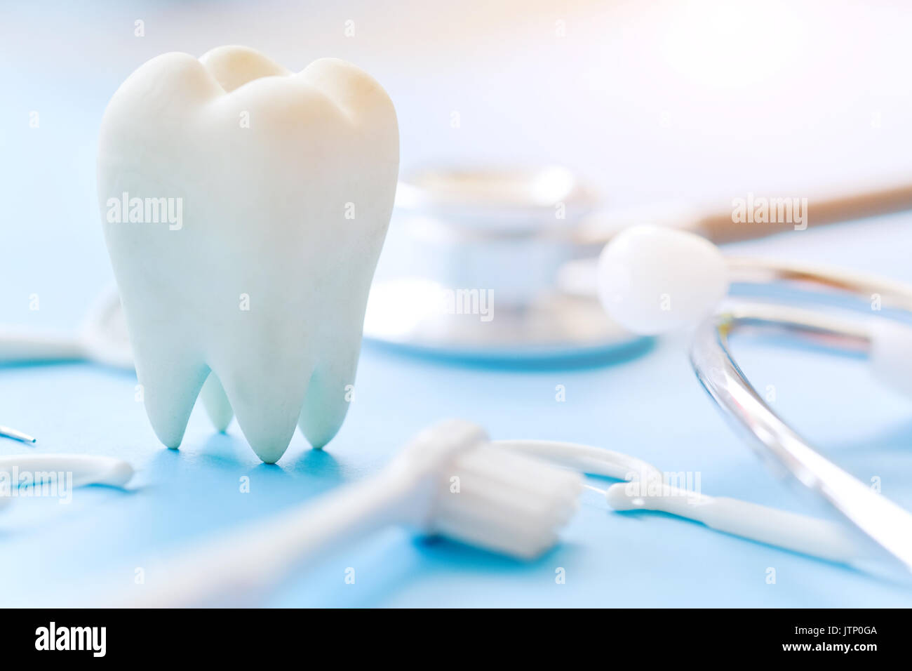 Dental model and dental equipment on blue background, concept image of ...
