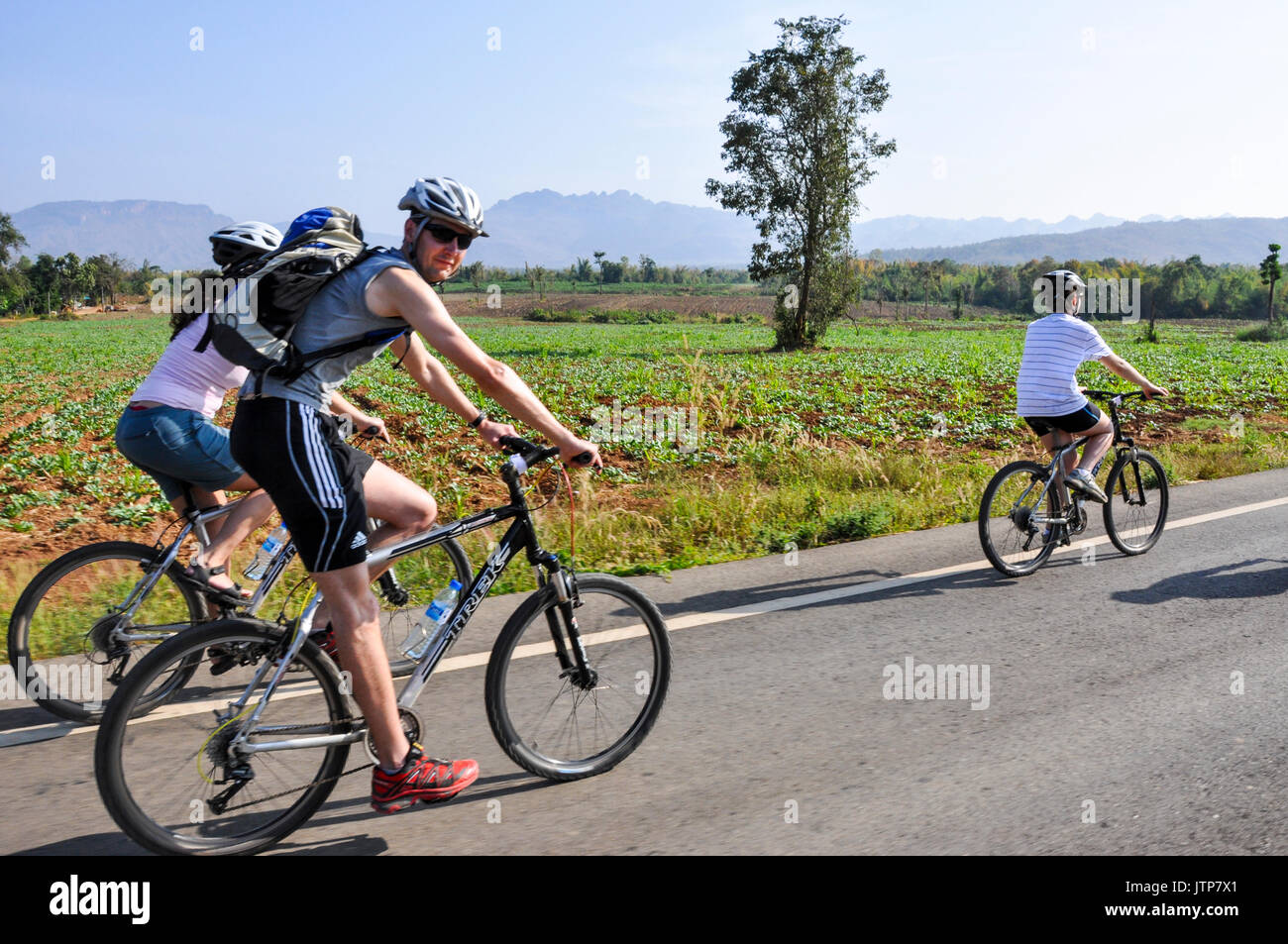 Tourists cycling in thailand hi-res stock photography and images - Alamy