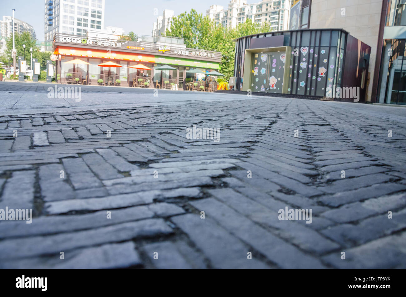 A low angle shot of a herring bone block paving Stock Photo - Alamy