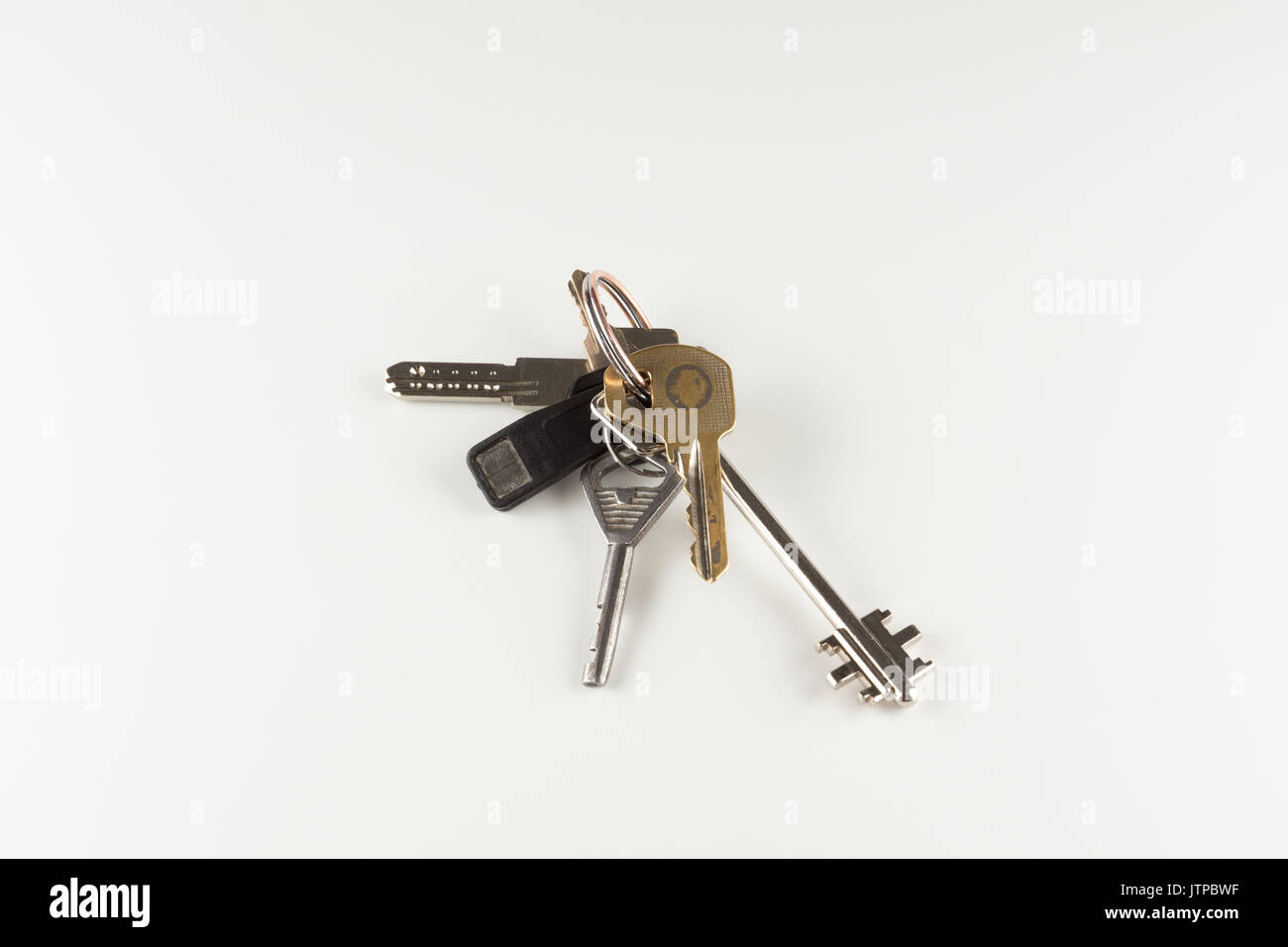 Set of house keys on white background Stock Photo - Alamy