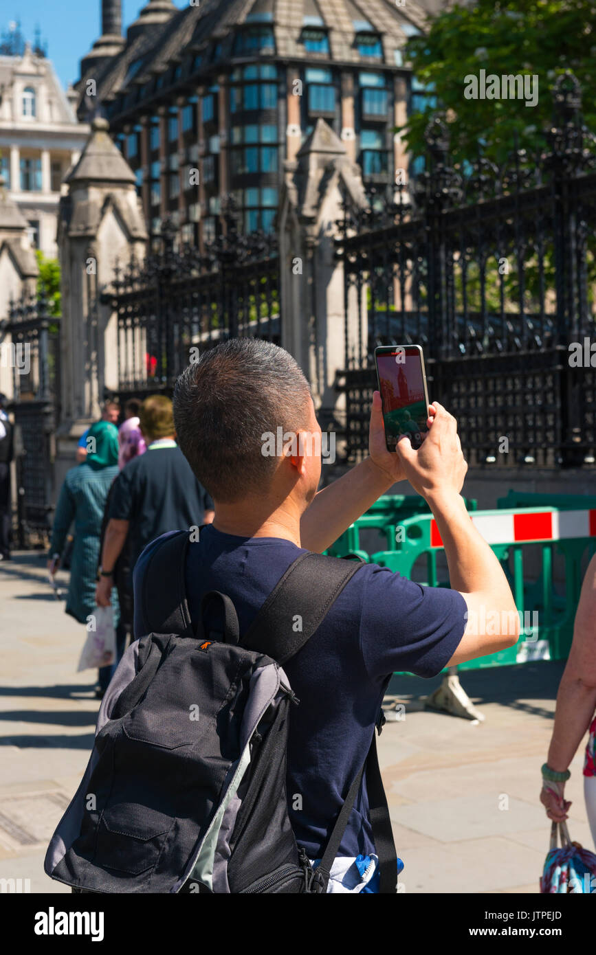 UK London Westminster Parliament Square tourist mobile cell phone photo ...