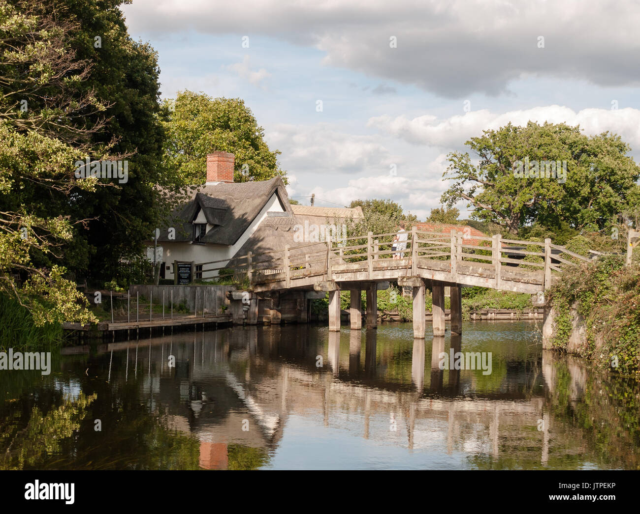 bridge crossing a river with reflections outside in country child and ...