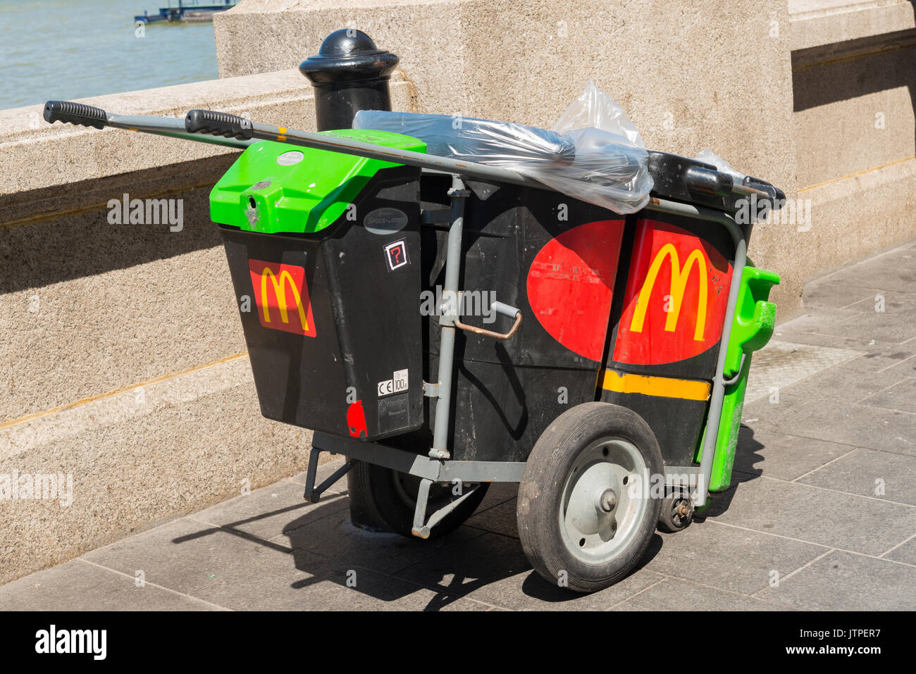 UK London Southbank McDonalds dust trash garbage rubbish litter cart ...