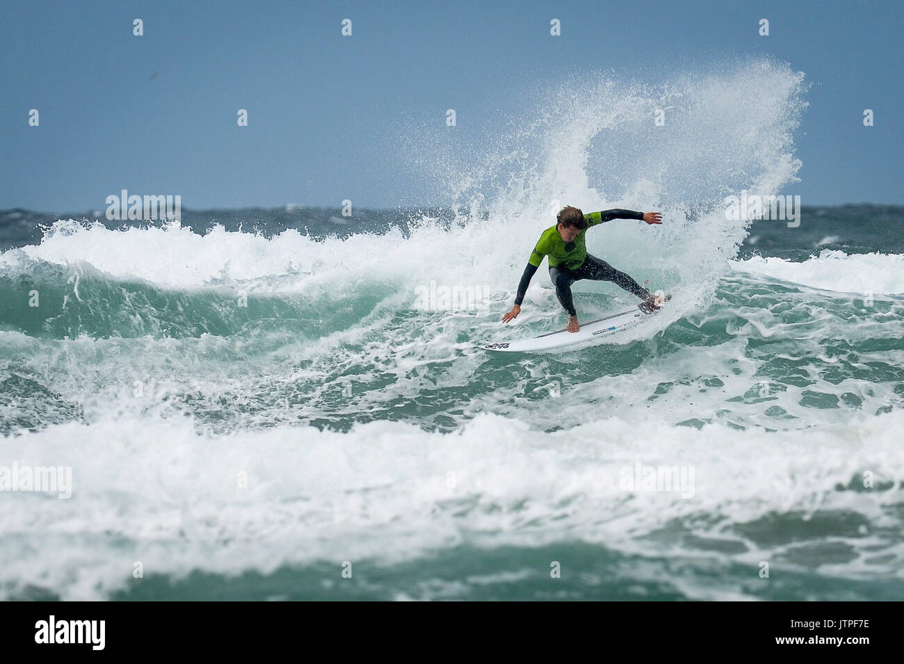 A surfer makes a turn on a wave during heats for the World Surf League ...