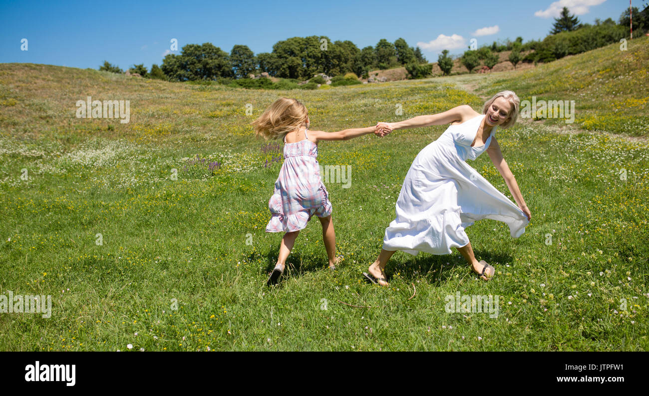Family harmony, mom and daughter rejoicing outdoors Stock Photo - Alamy