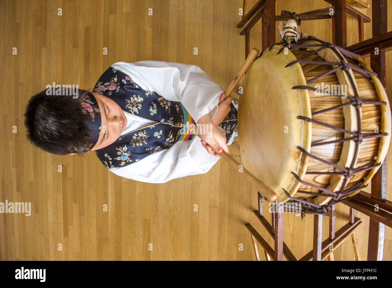 Young traditional Korean drummer preforms rhythmic set on buk drums ...