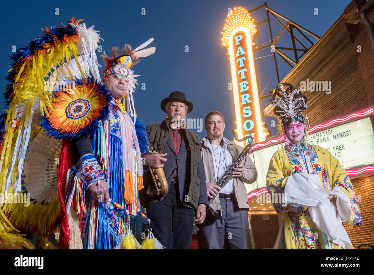 Group of various folk performers stand in front of Creative Alliance in ...