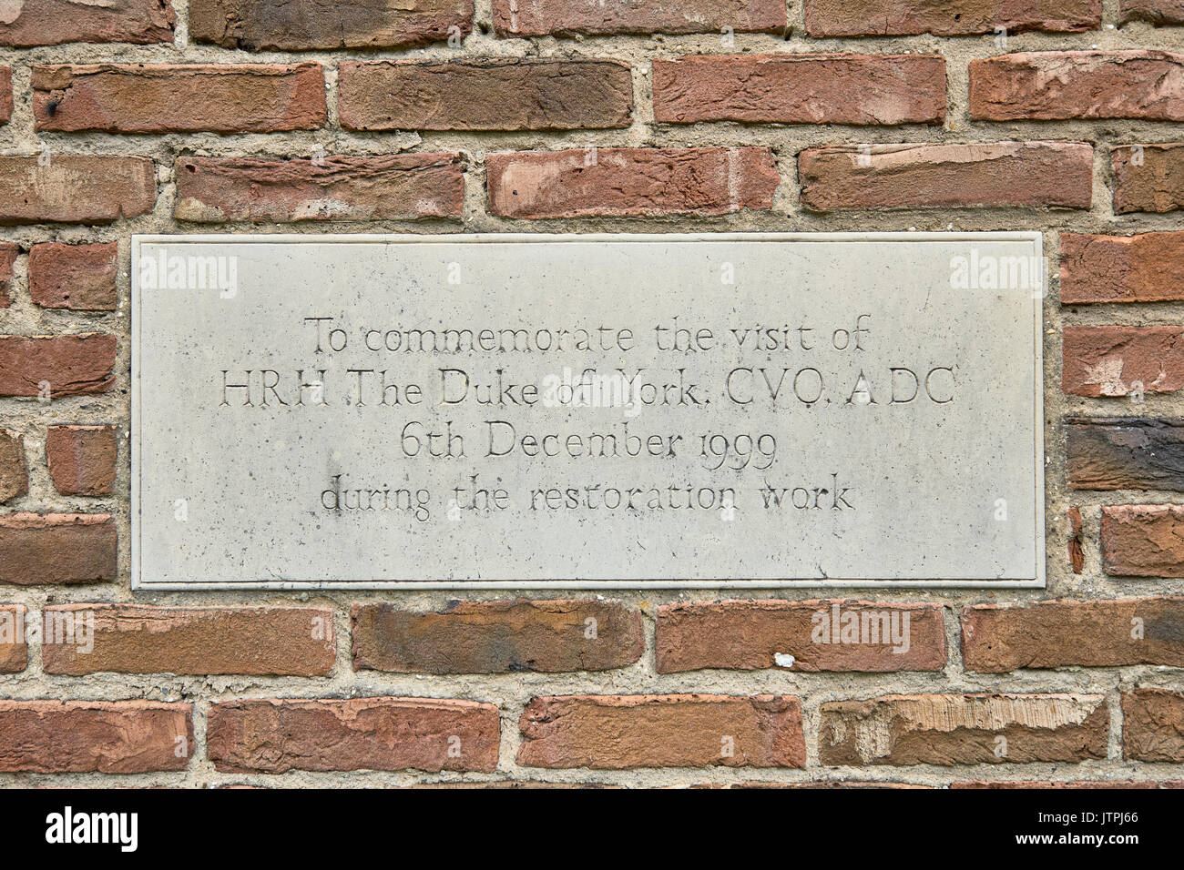 Plaque inset into brick wall commemorating opening of restored Nether ...