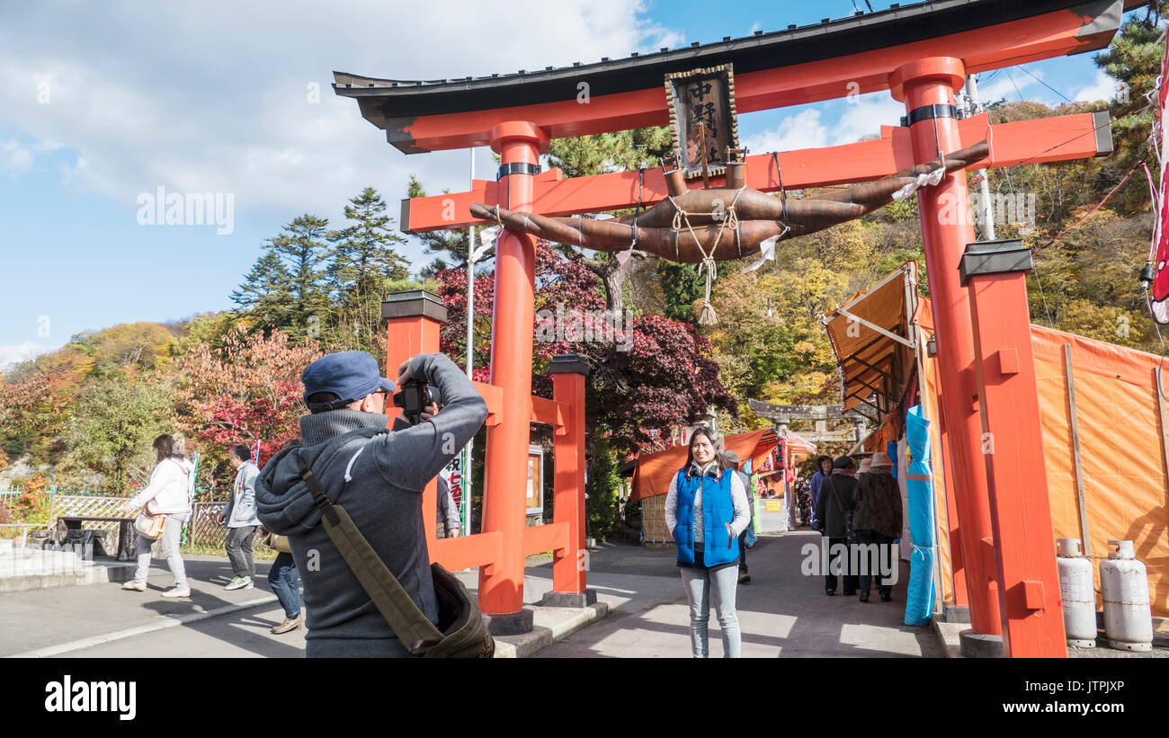 The Fudo stream and the red bridge at Mount Nakano-Momiji Stock Photo ...