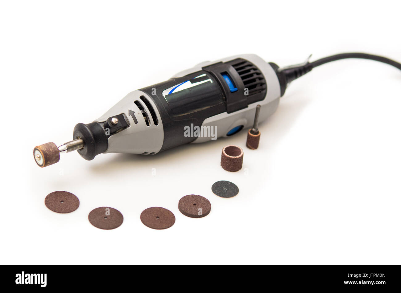 A gray drill with drilling accessories on white background Stock Photo ...